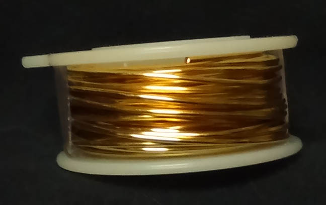 spool of gold colored jewelry wire